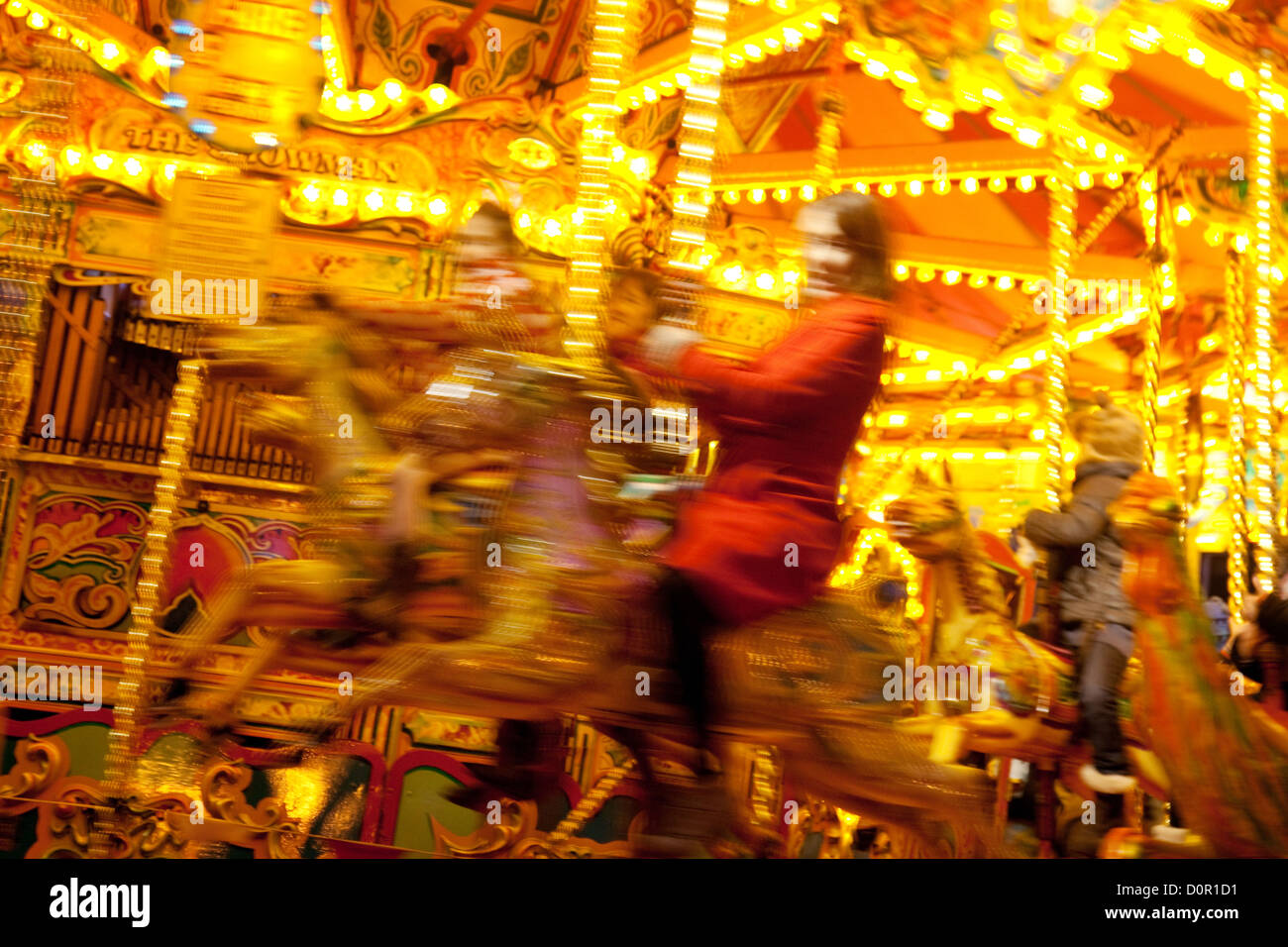 Woman riding carousel horse hi-res stock photography and images - Alamy
