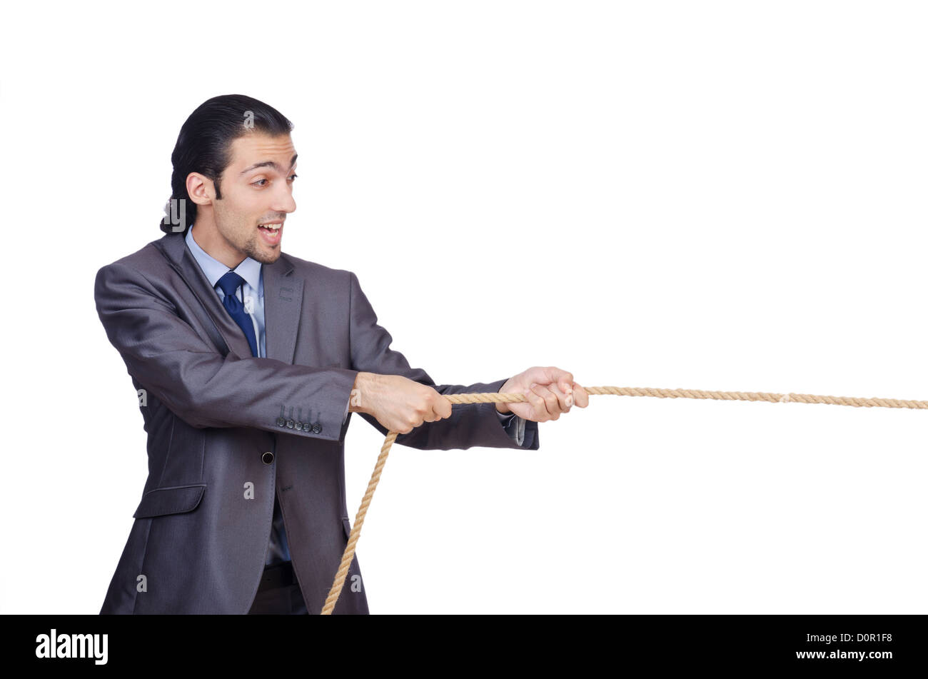 Businessman pulling rope on white Stock Photo - Alamy