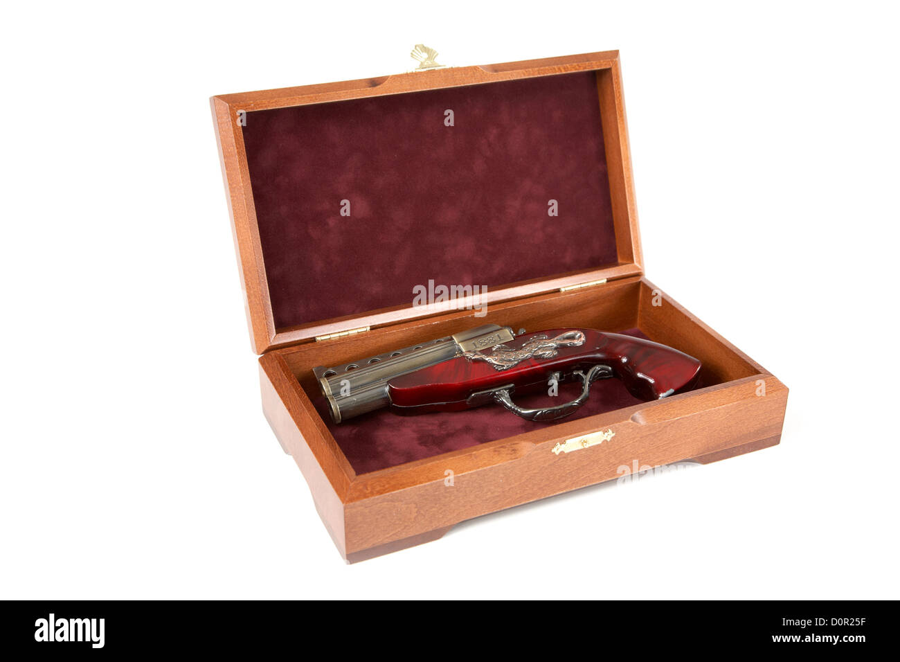 Casket with a toy pistol Stock Photo - Alamy