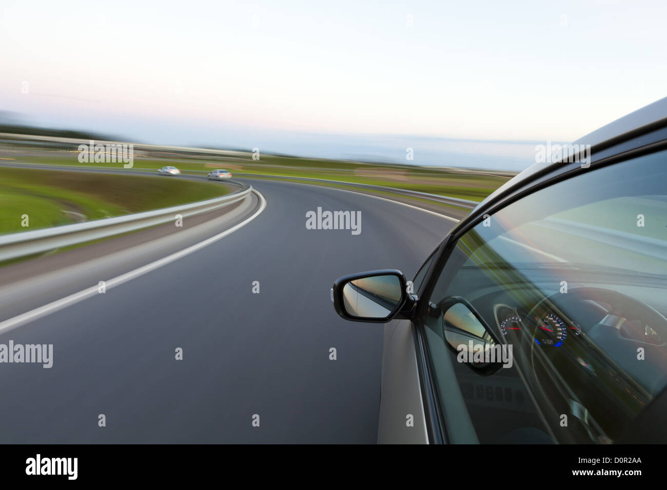 Car goes very fast to turn a country road Stock Photo - Alamy