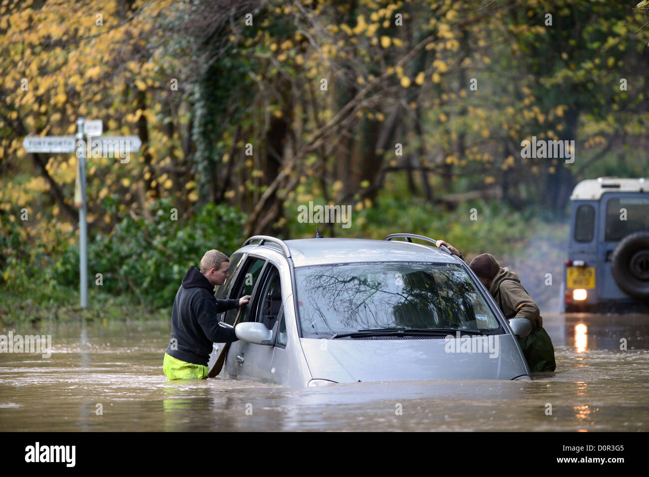 A car stuck at Damery in Gloucestershire where the Little Avon River ...