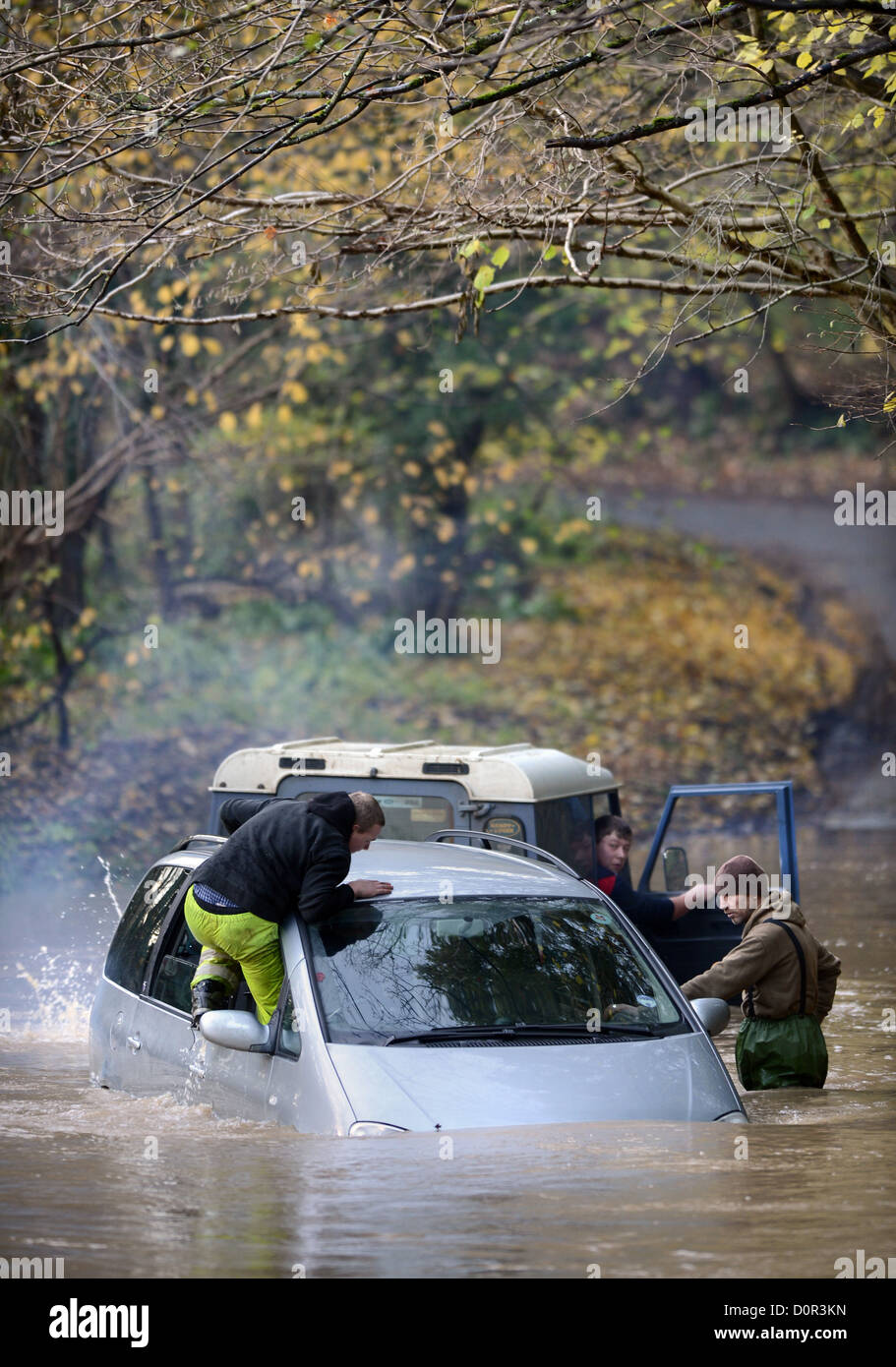 A car stuck at Damery in Gloucestershire where the Little Avon River ...