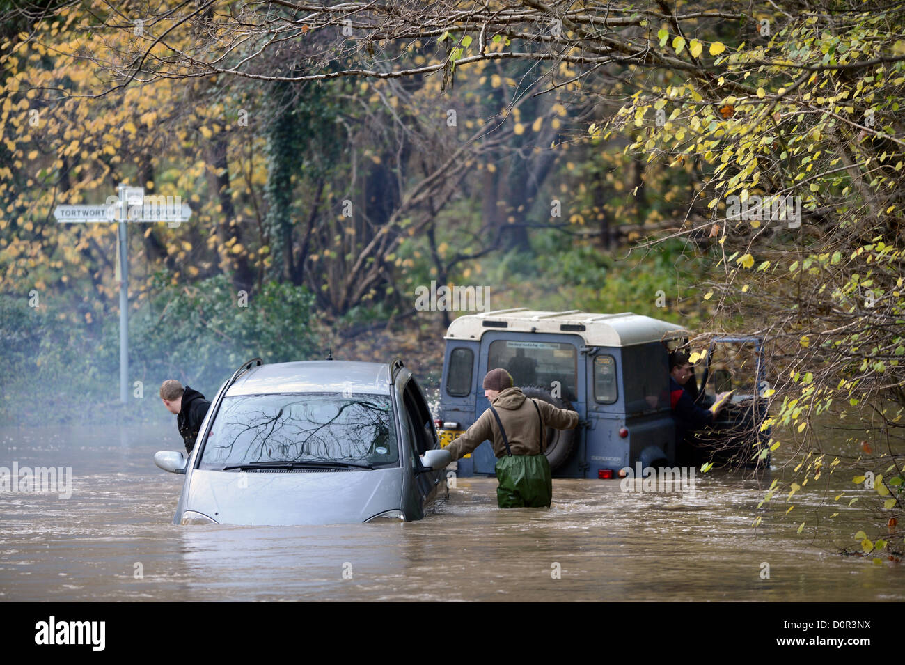 A car stuck at Damery in Gloucestershire where the Little Avon River ...