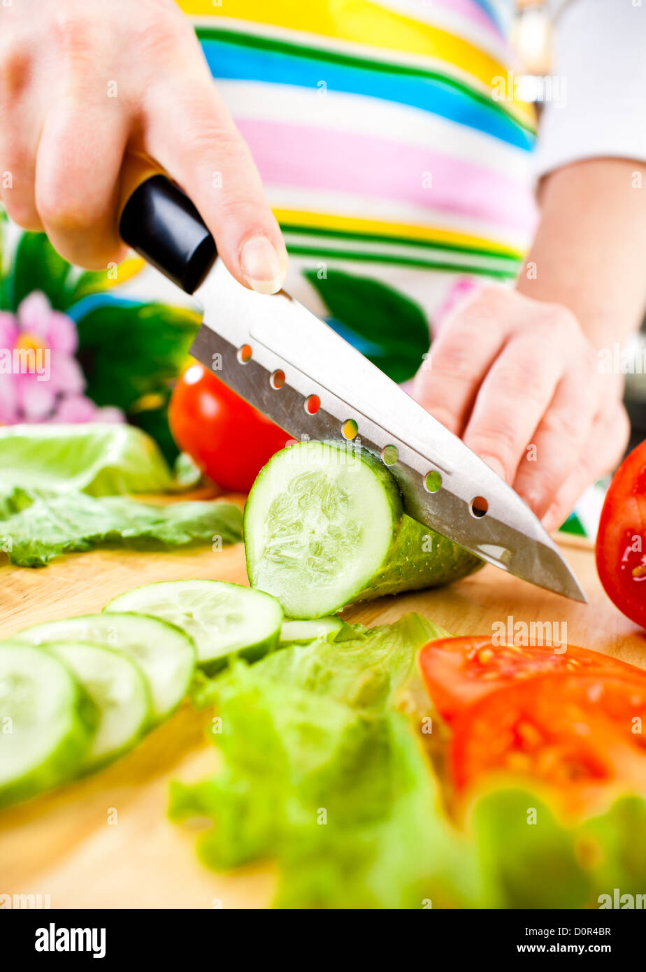 Woman's hands cutting vegetables Stock Photo - Alamy