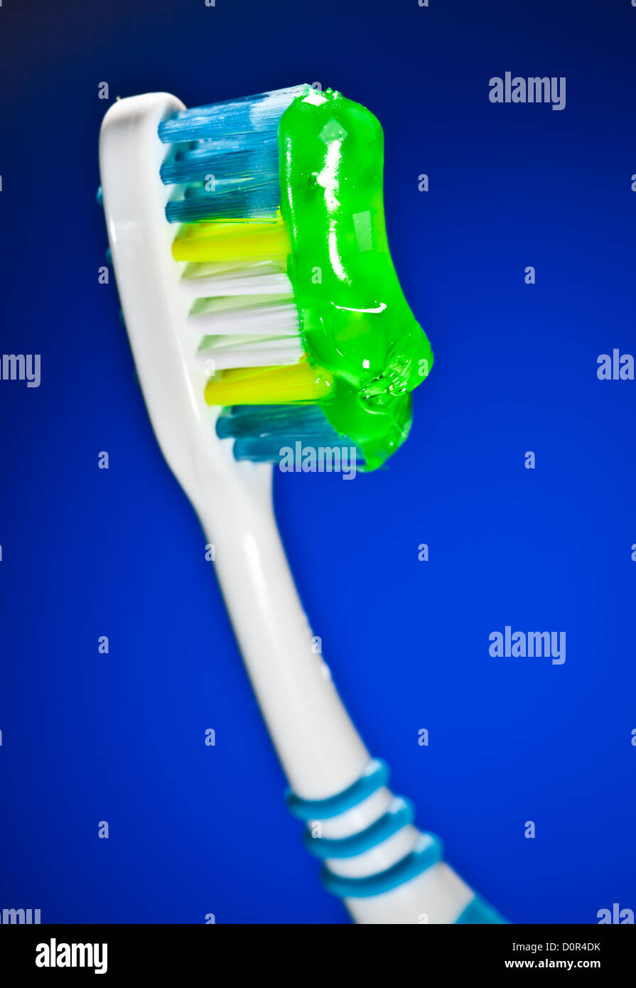 toothbrush on a dark blue background Stock Photo - Alamy