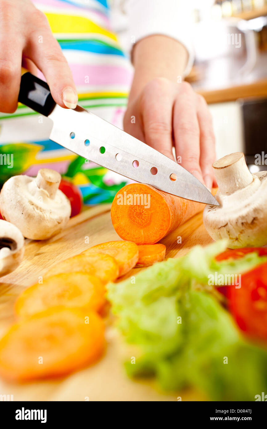 Woman's hands cutting vegetables Stock Photo - Alamy