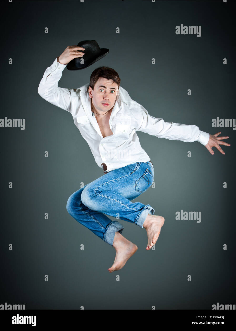man with a hat in a jump Stock Photo - Alamy