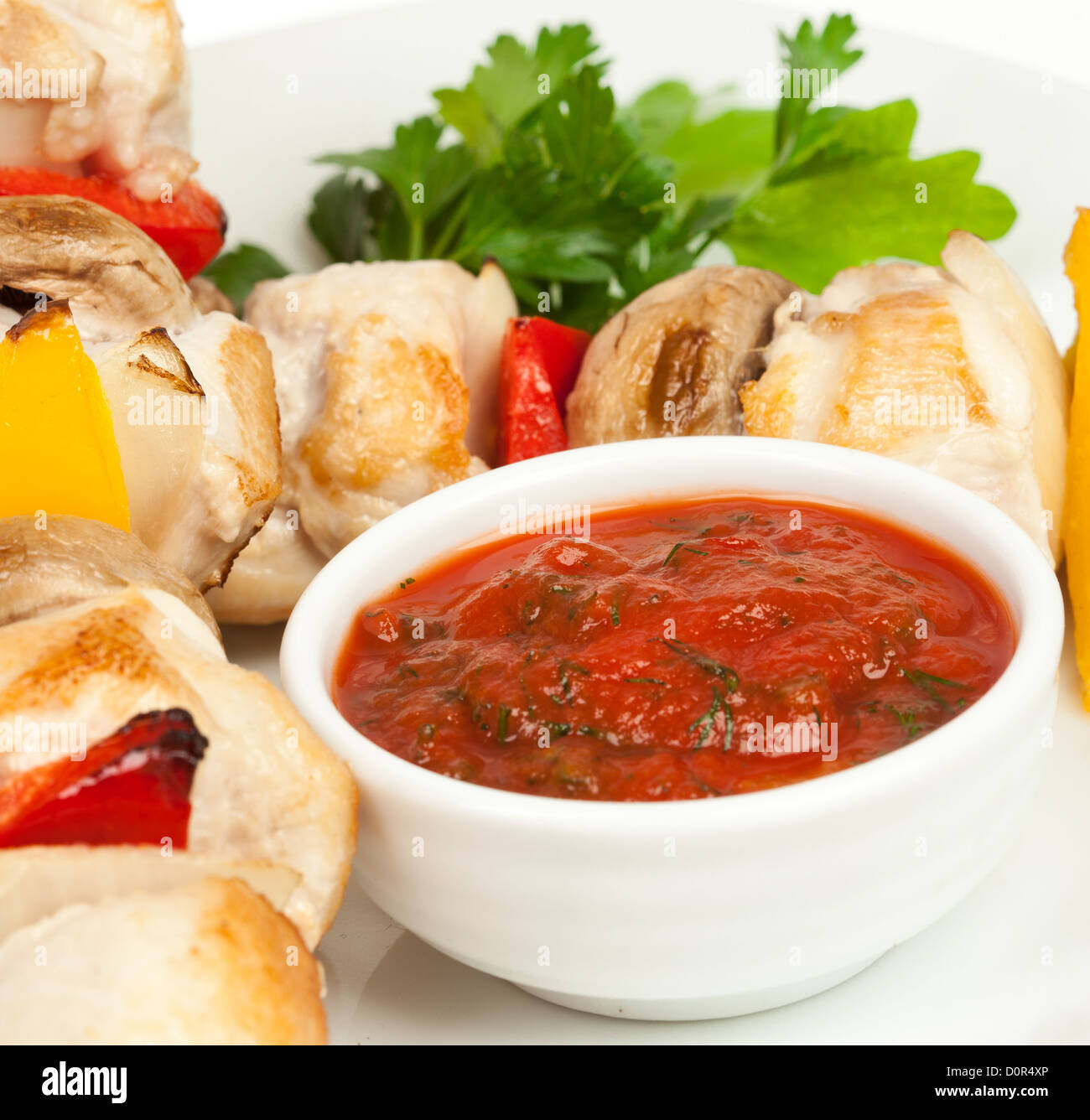 Fried pieces of a hen with sauce Stock Photo - Alamy