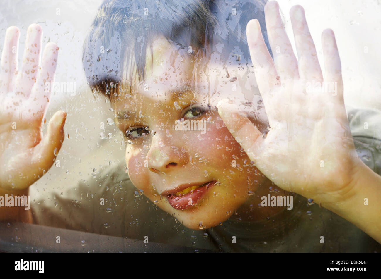 child and window on a wet rainy day Stock Photo - Alamy