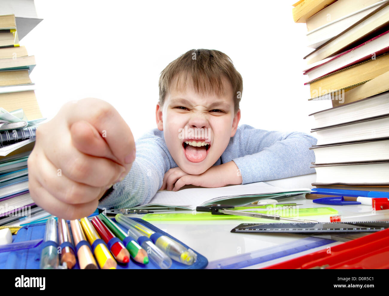 boy behind a table with books Stock Photo - Alamy