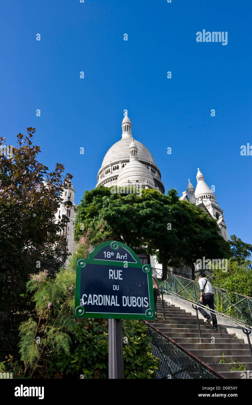 Tourist climbing steps up to Basilica of Sacre Coeur Montmartre Paris ...