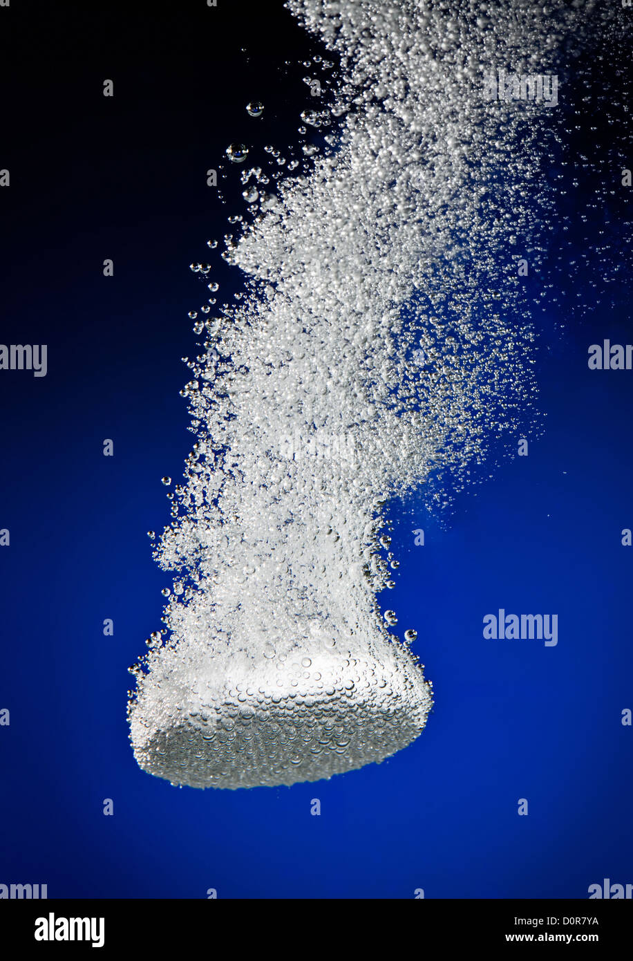 Effervescent tablet in water with bubbles Stock Photo - Alamy