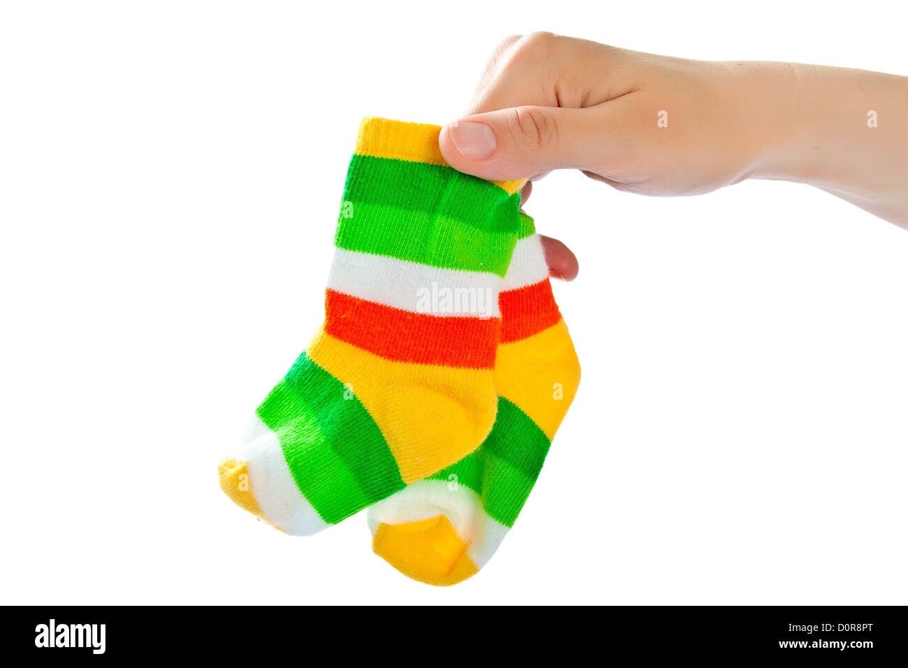 Two baby socks in woman's hand Stock Photo - Alamy
