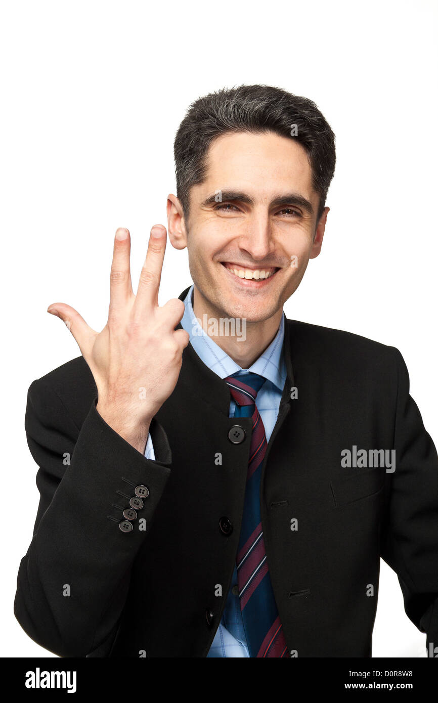 Young businessman is showing hand signs Stock Photo - Alamy