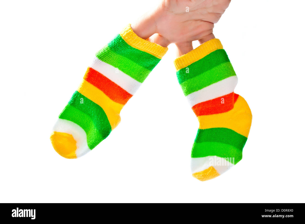 Two baby socks in woman's hand Stock Photo - Alamy