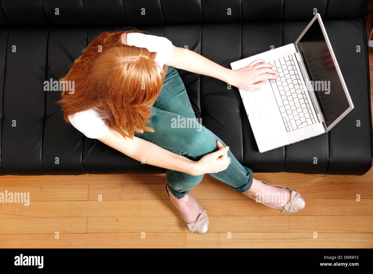 A young woman surfing on the Internet with a Laptop Stock Photo - Alamy
