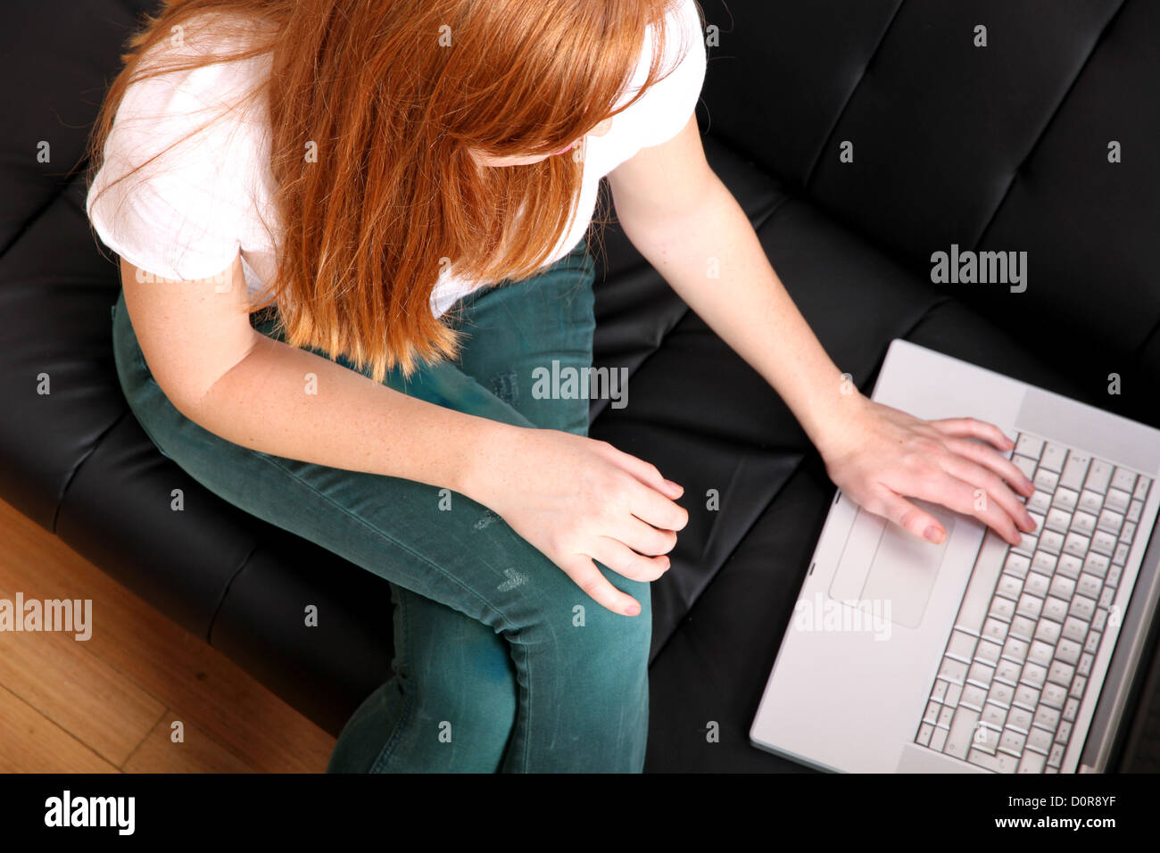 A young woman surfing on the Internet with a Laptop Stock Photo - Alamy