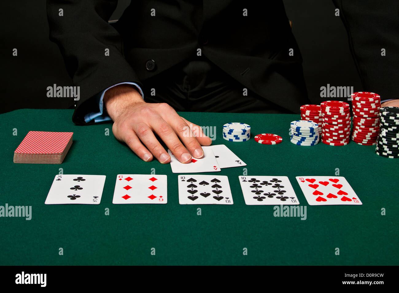 Gambler with cards and chips Stock Photo - Alamy