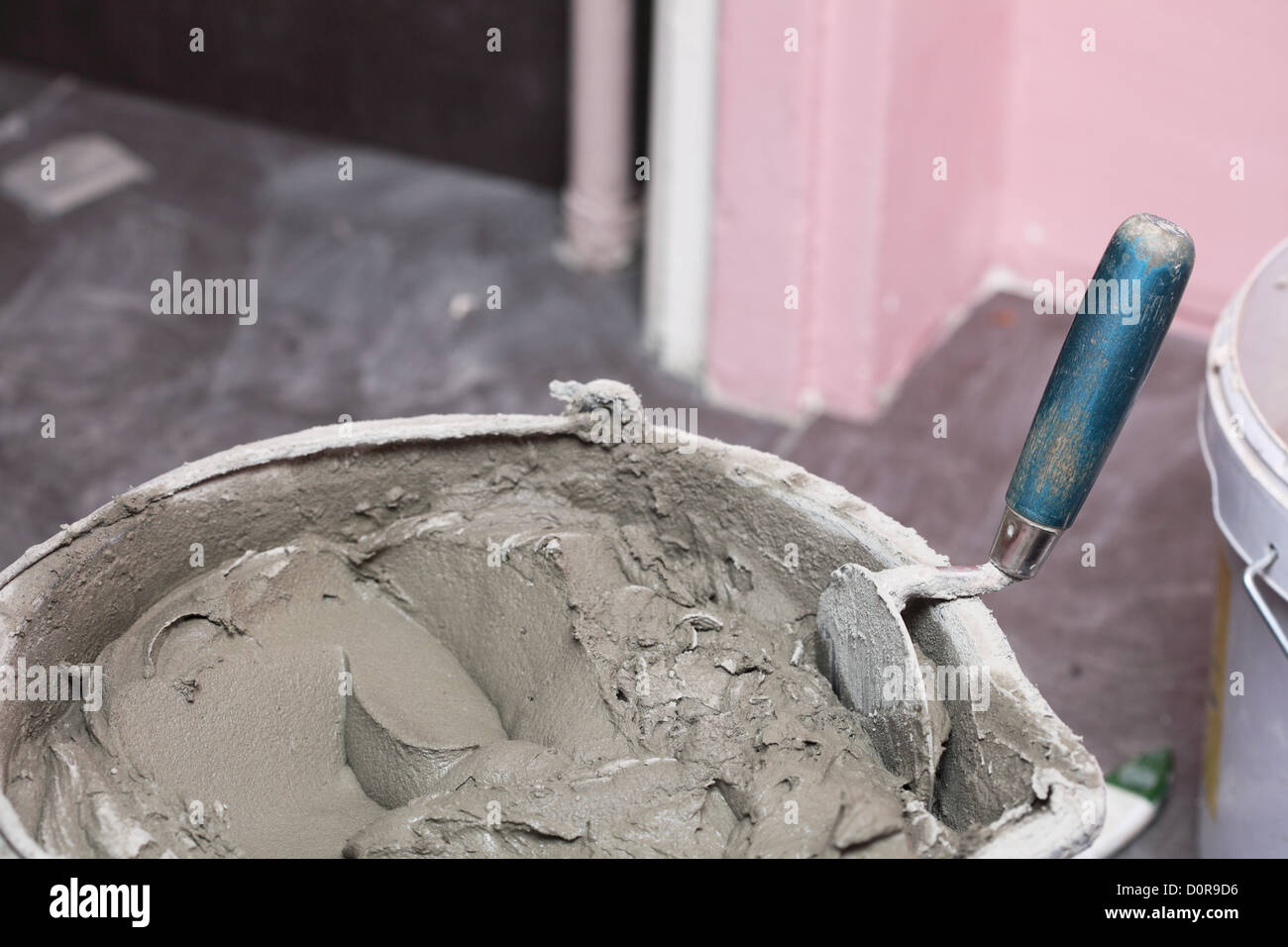 mortar on wall construction notched trowel work tools Stock Photo - Alamy