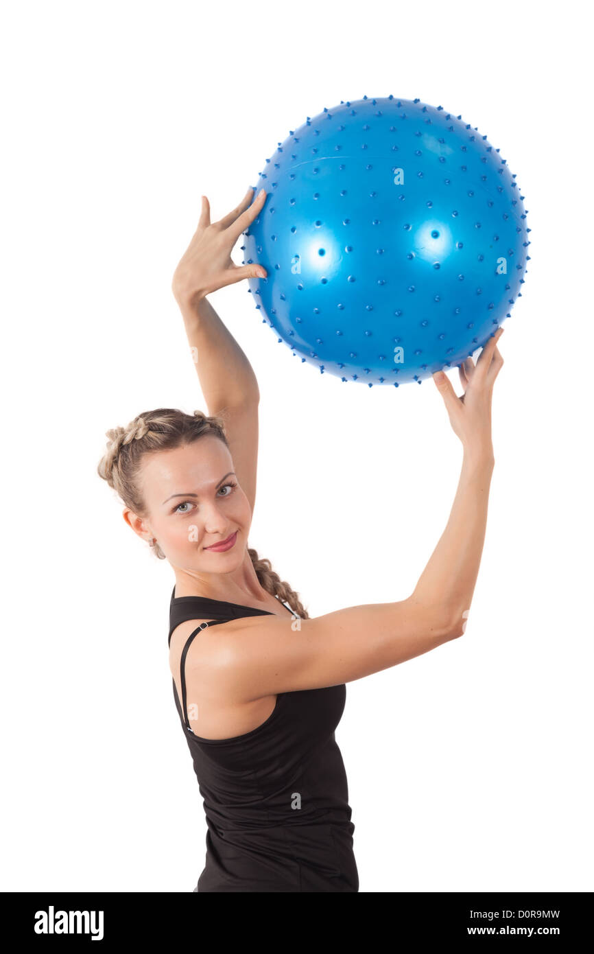 Athletic young woman with blue ball Stock Photo - Alamy