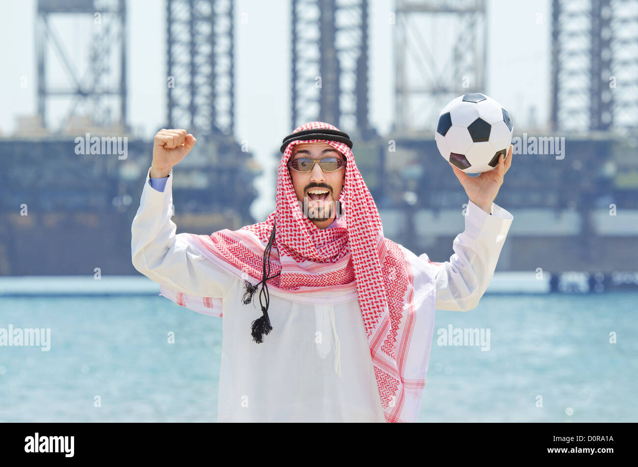 Arab with footbal at seaside Stock Photo - Alamy