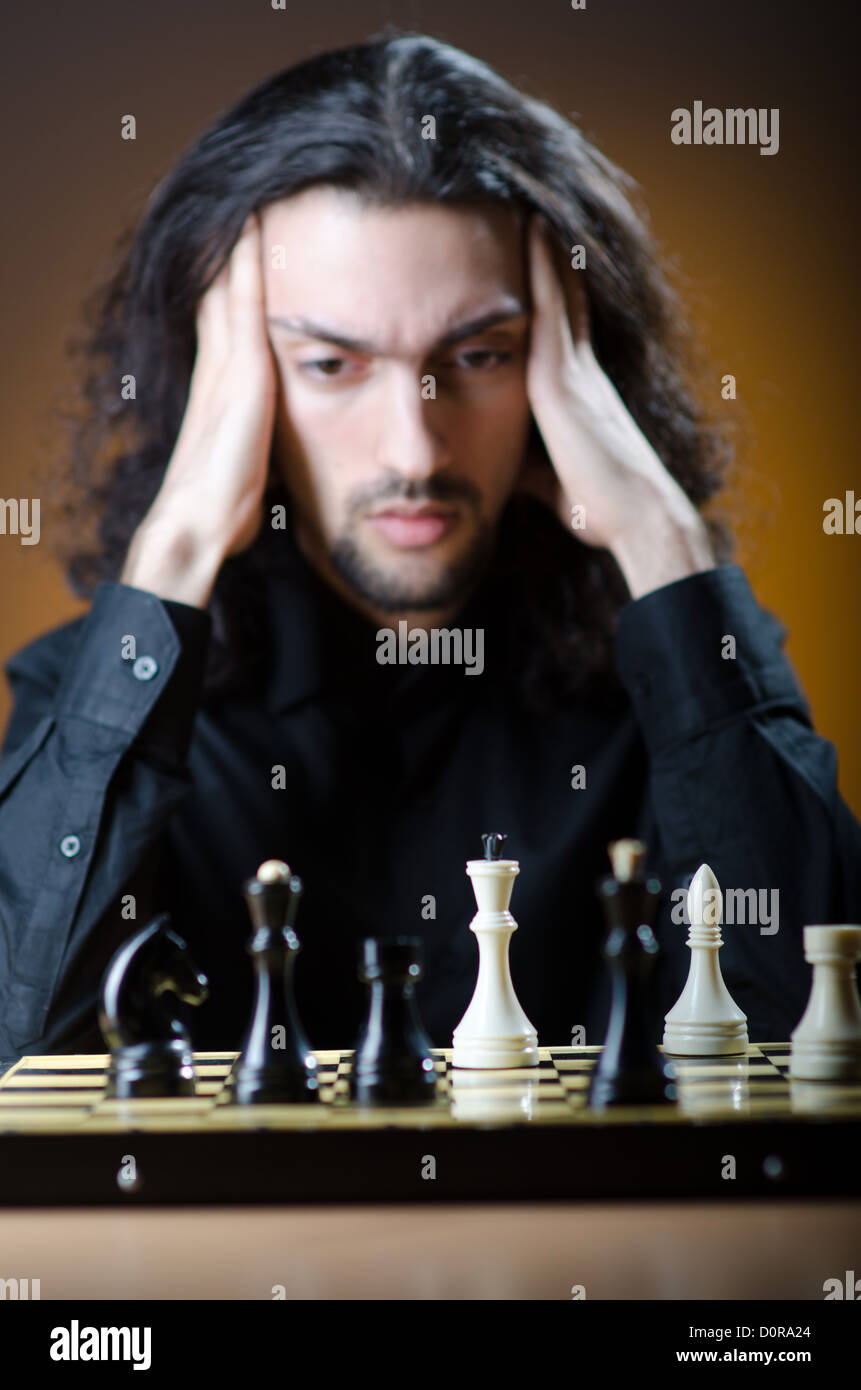 Chess player playing his game Stock Photo - Alamy
