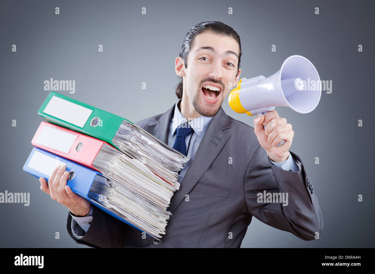 Businessman shouting via loudspeaker Stock Photo - Alamy