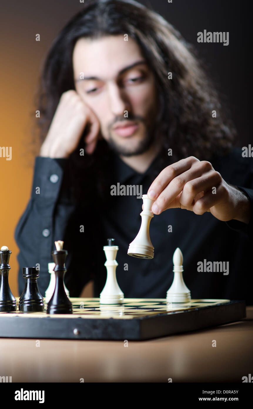 Chess player playing his game Stock Photo - Alamy