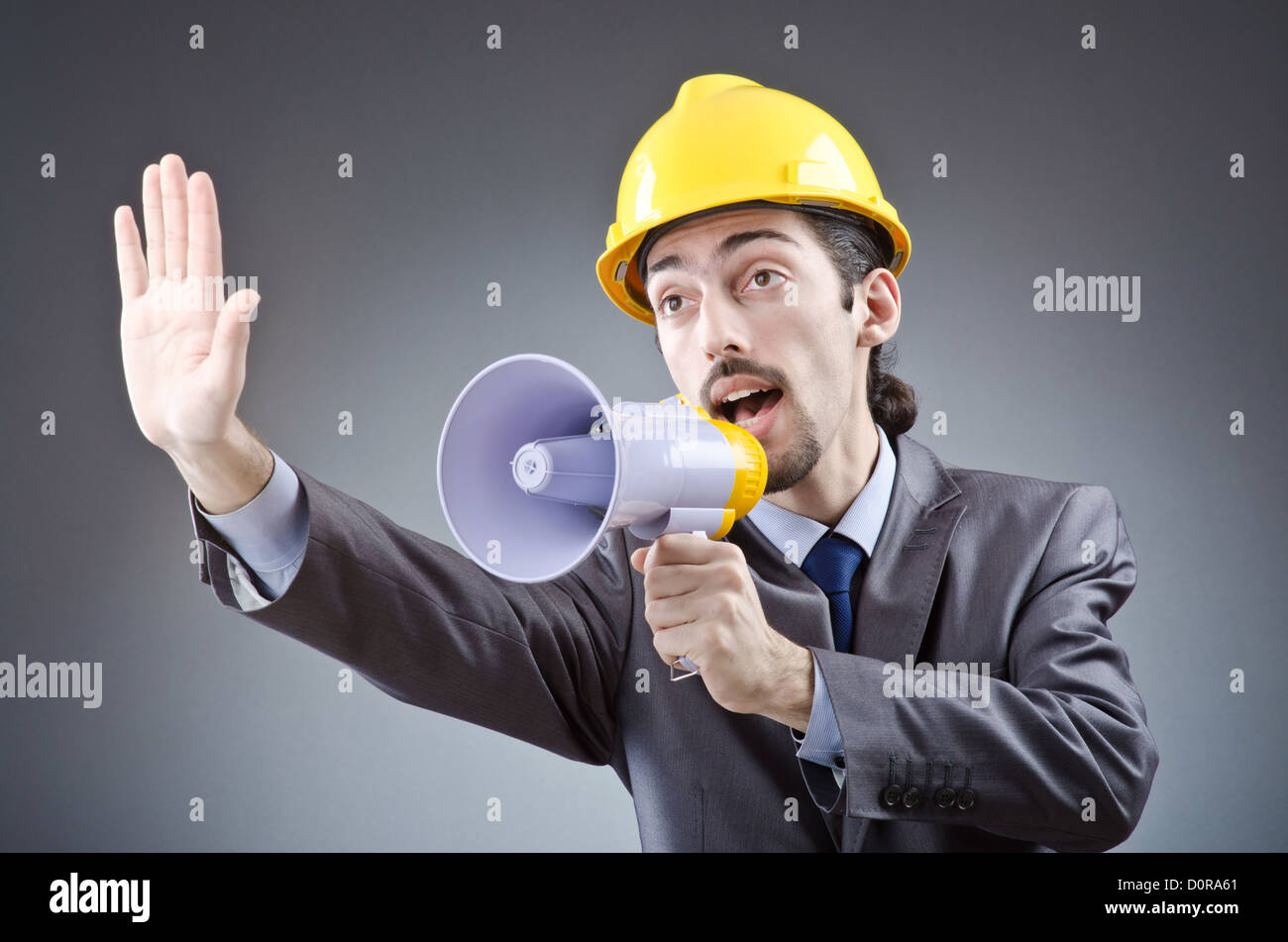 Man shouting and yelling with loudspeaker Stock Photo - Alamy