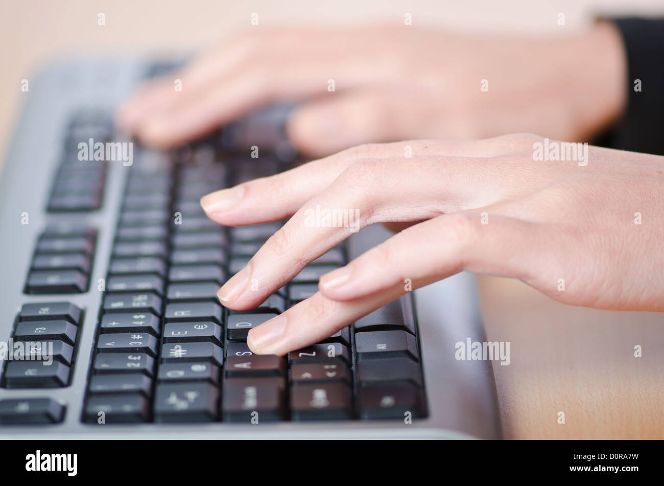Hands typing on the keyboard Stock Photo - Alamy