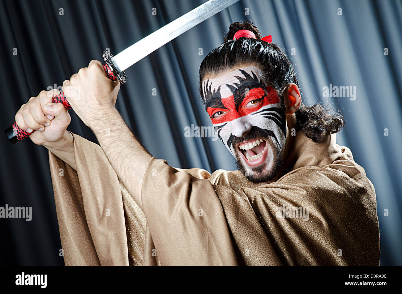 Man with face mask and sword Stock Photo - Alamy