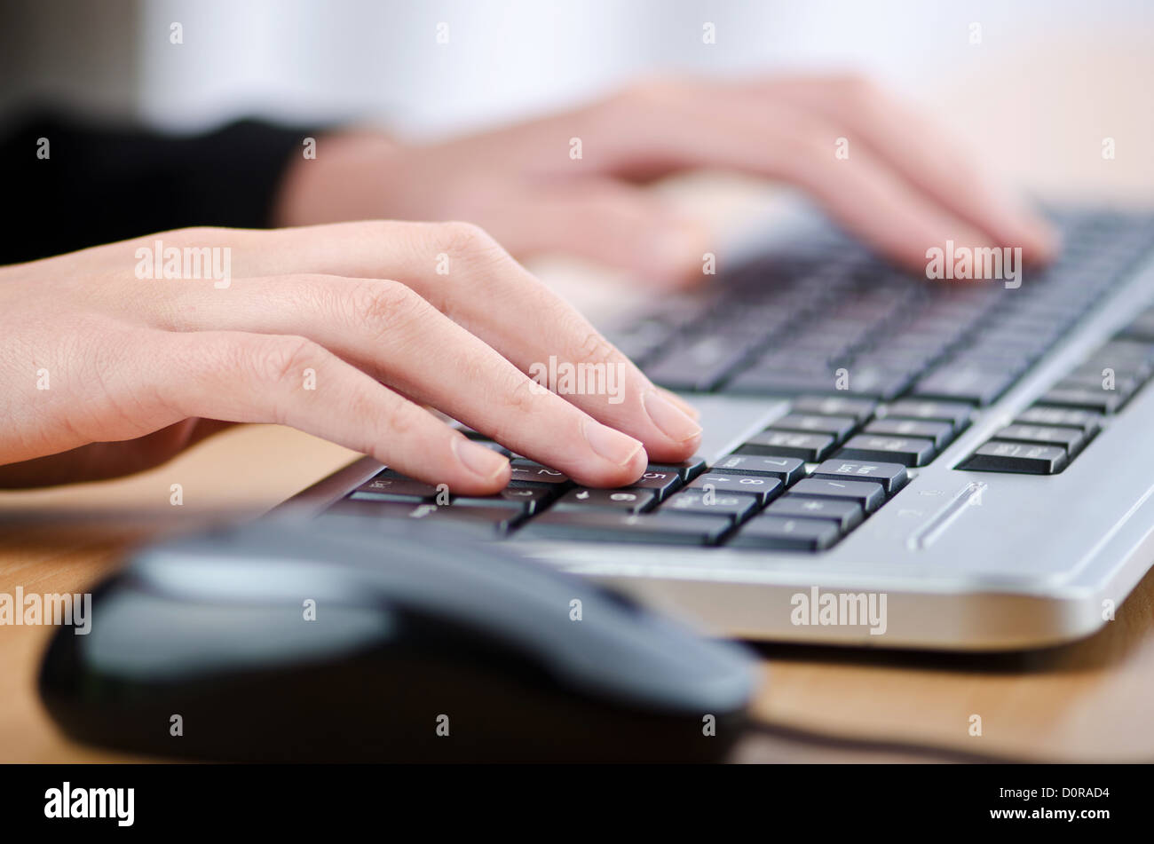 Hands typing on the keyboard Stock Photo - Alamy