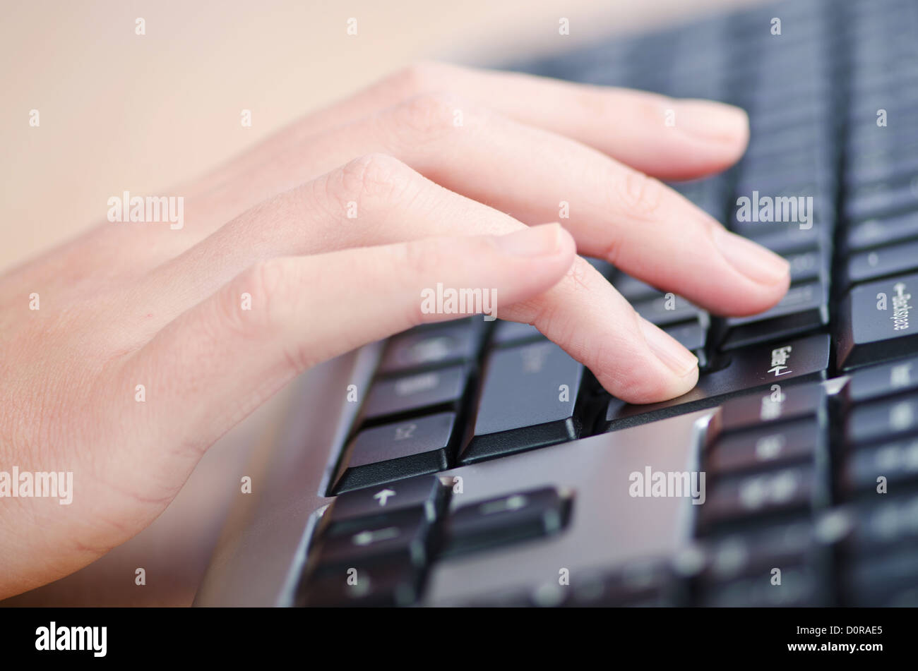 Hands typing on the keyboard Stock Photo - Alamy