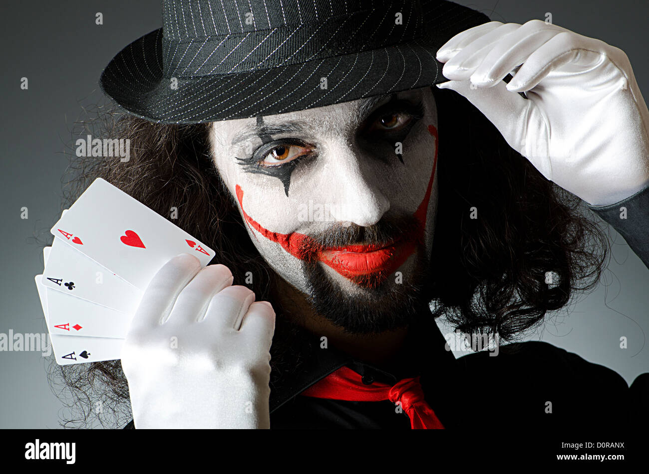 Joker with cards in studio shoot Stock Photo - Alamy