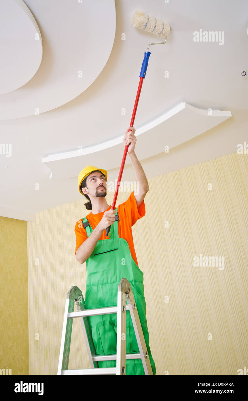 Painter worker during painting job Stock Photo - Alamy