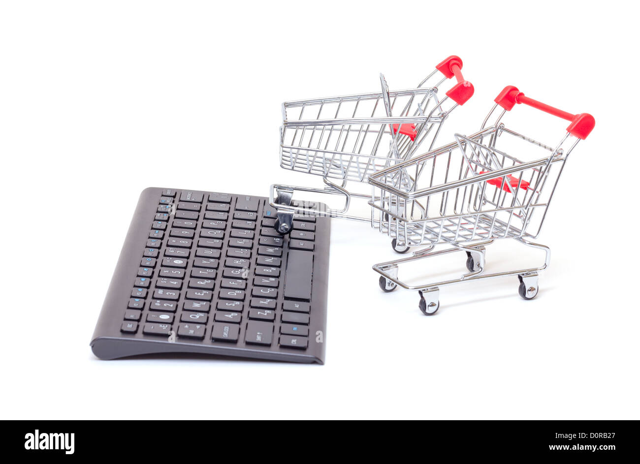 Computer keyboard with shopping carts Stock Photo - Alamy