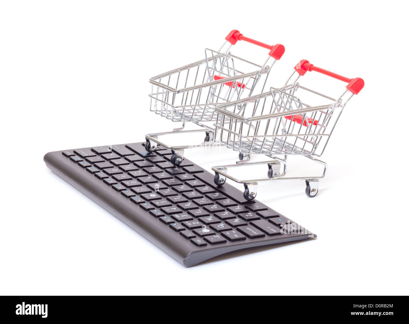 Computer keyboard with shopping carts Stock Photo - Alamy