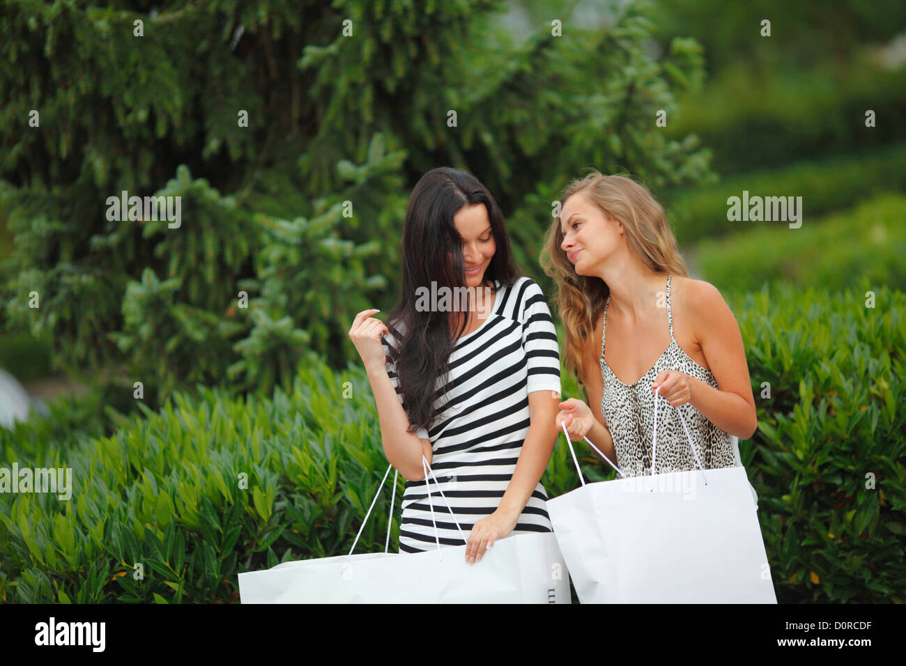Two woman shopping Stock Photo - Alamy