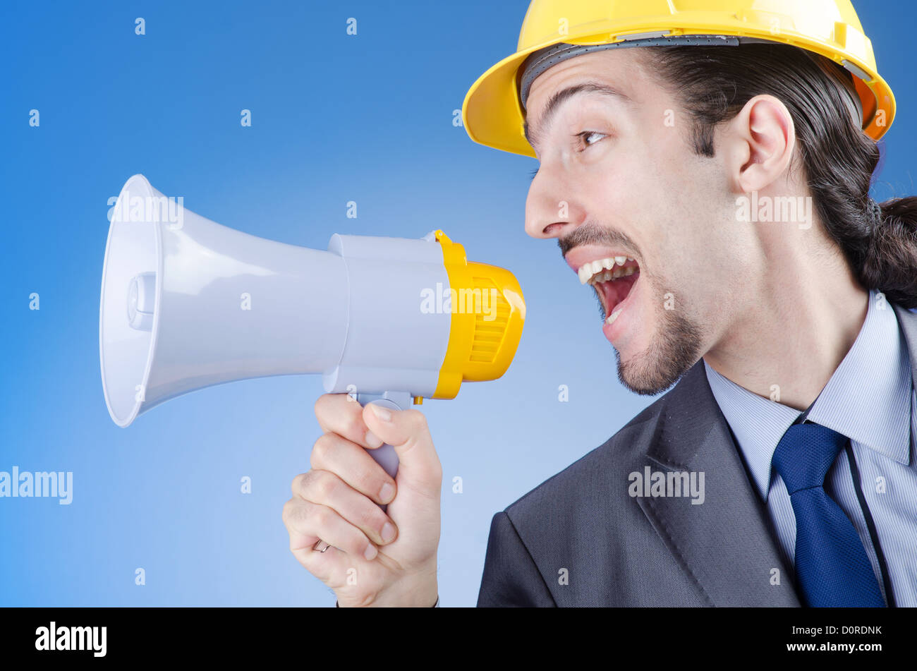 Construction worker shouting via loudspeaker Stock Photo - Alamy