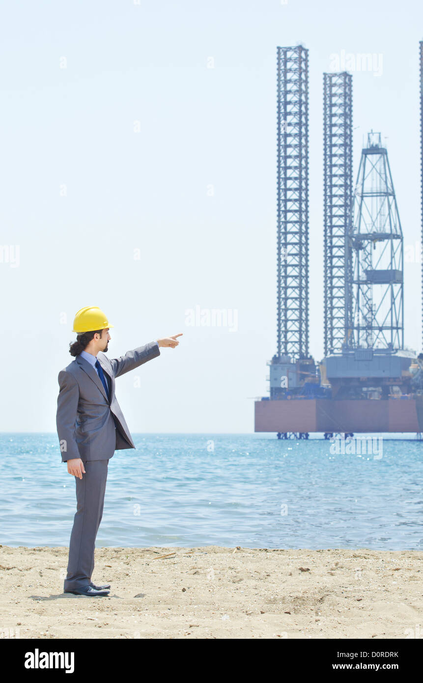 Oil engineer on sea side beach Stock Photo - Alamy