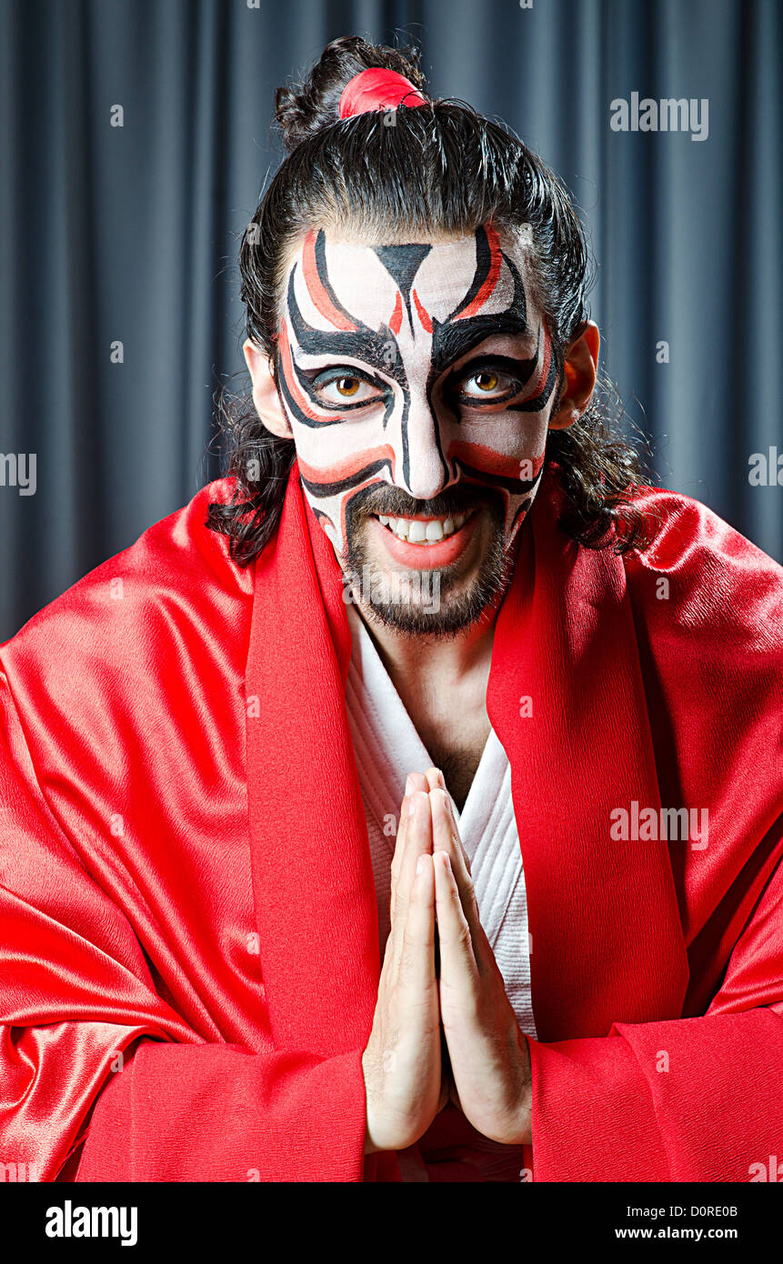 Man with face mask and sword Stock Photo - Alamy