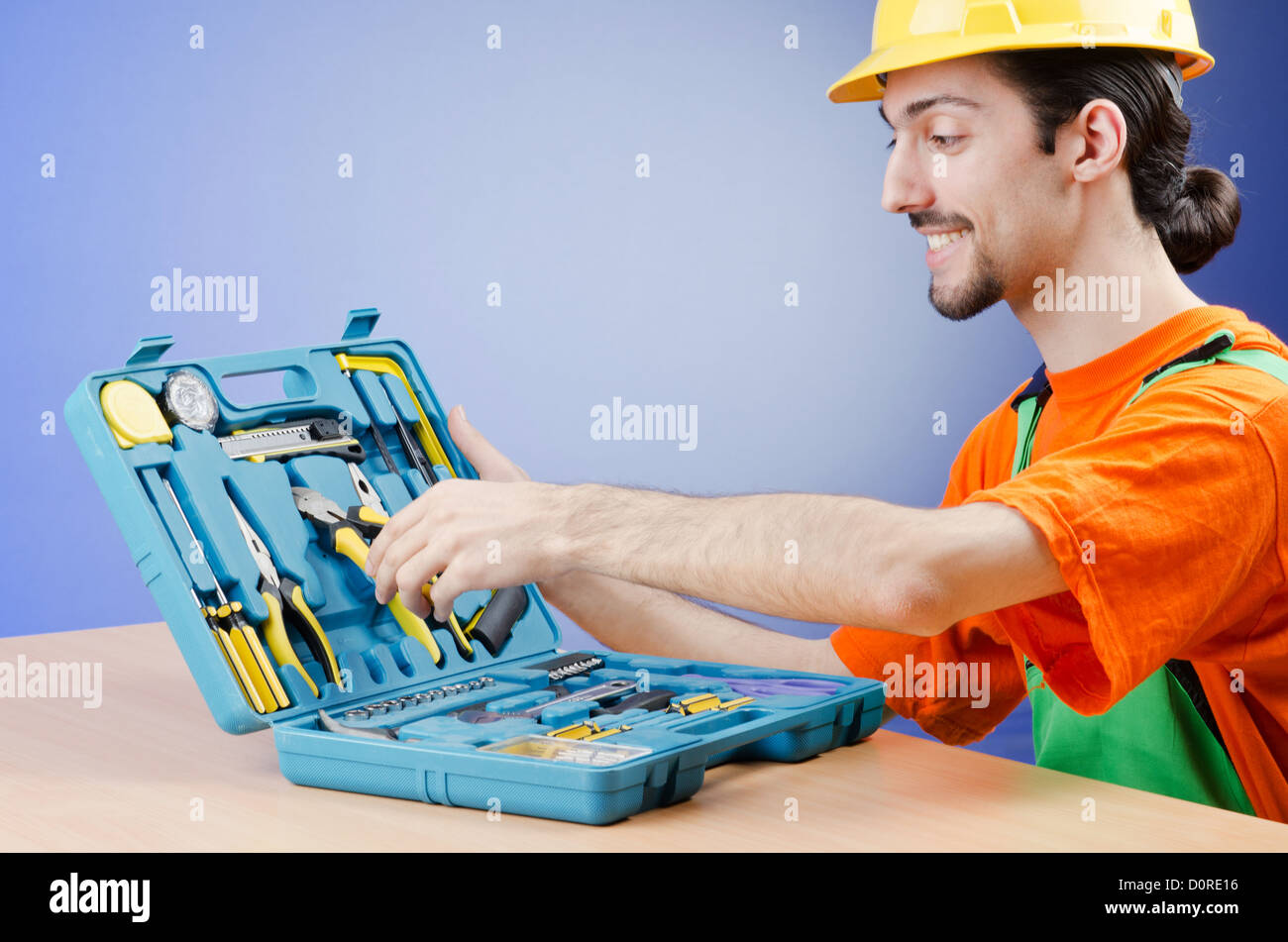 Repairman with his toolkit Stock Photo - Alamy