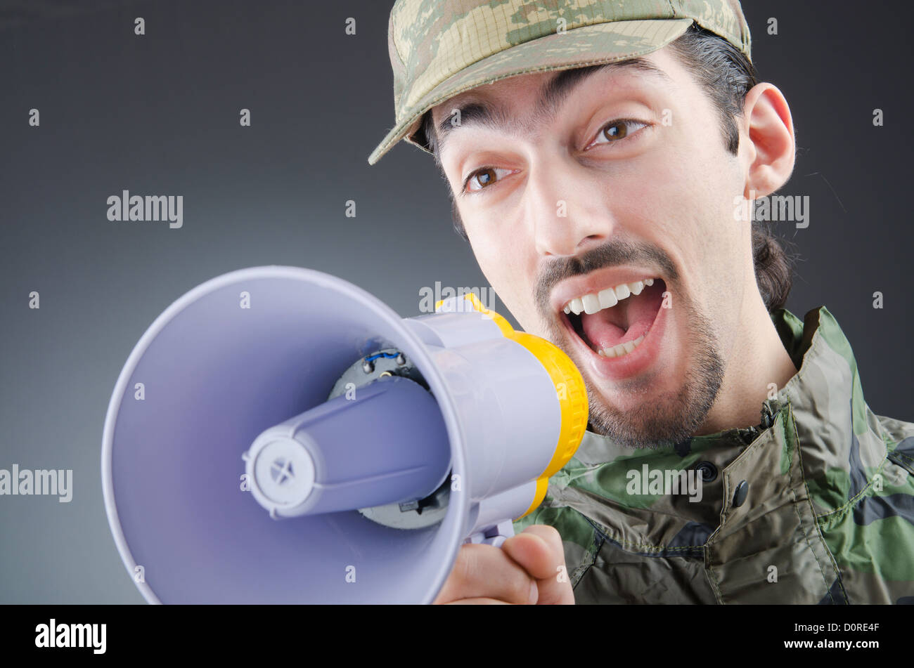 Soldier with loudspeaker shouting Stock Photo - Alamy