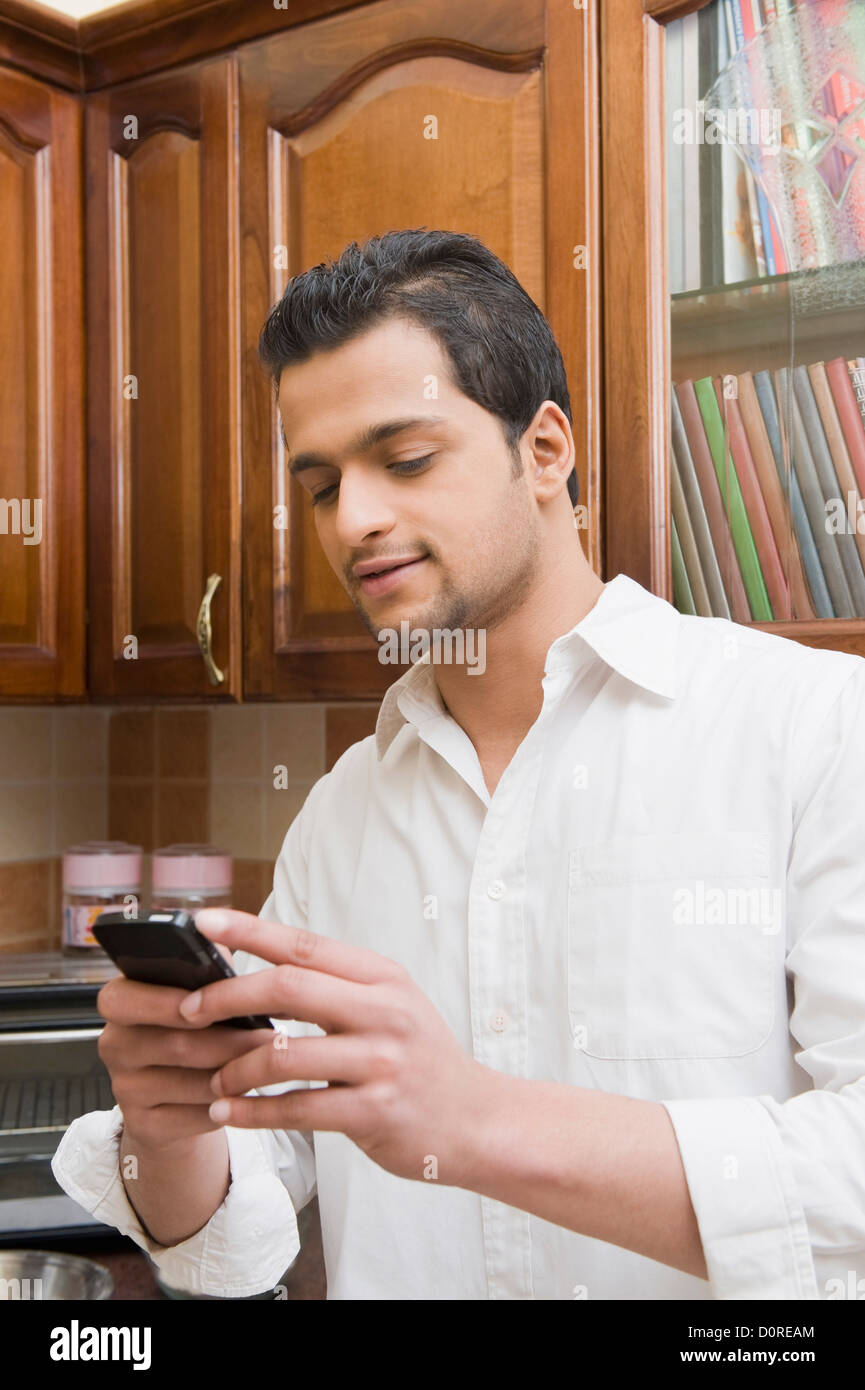 Man text messaging on a mobile phone Stock Photo - Alamy