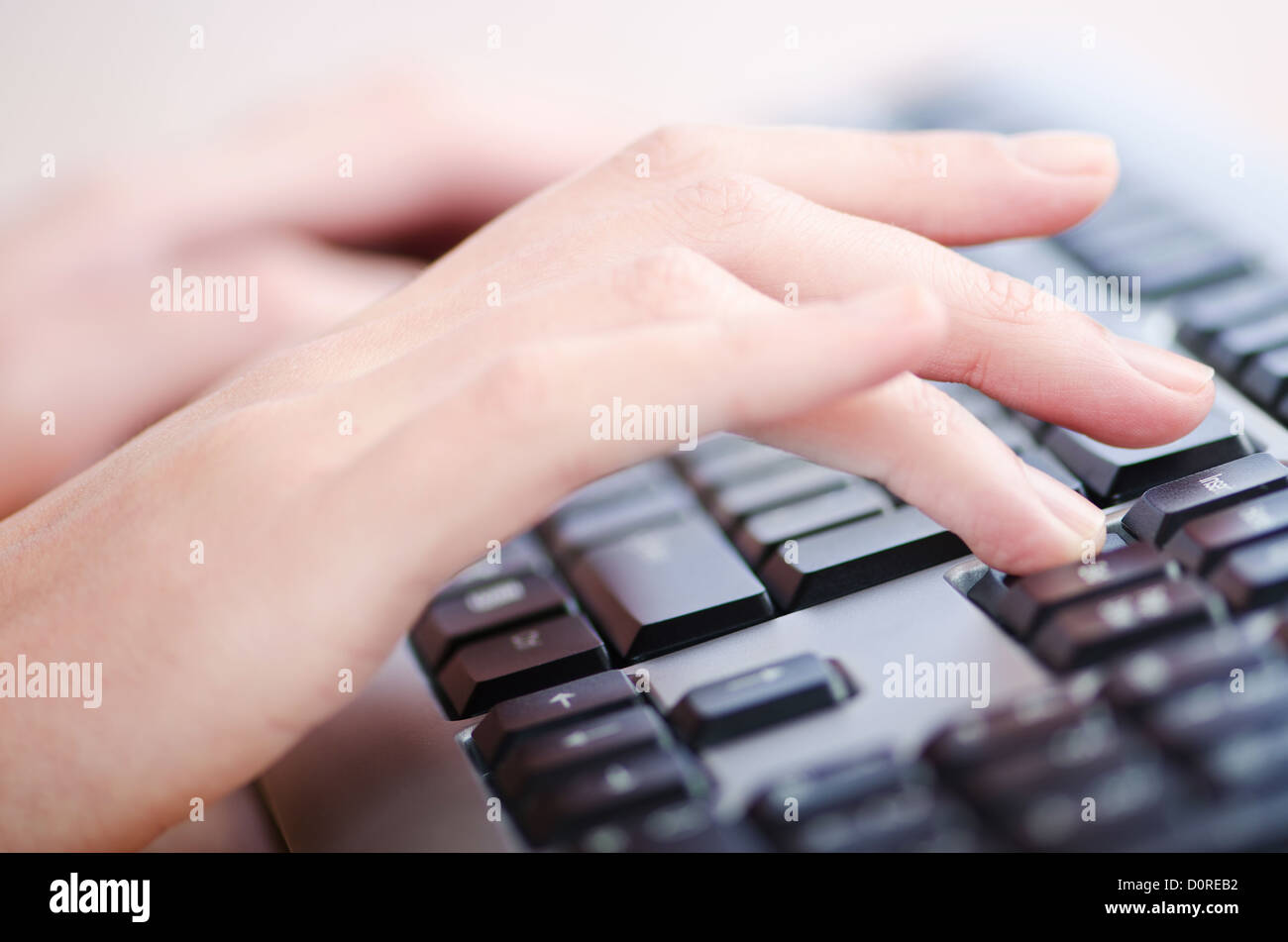 Hands typing on the keyboard Stock Photo - Alamy