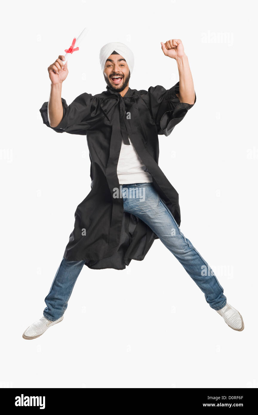 University student jumping with his graduation diploma Stock Photo - Alamy