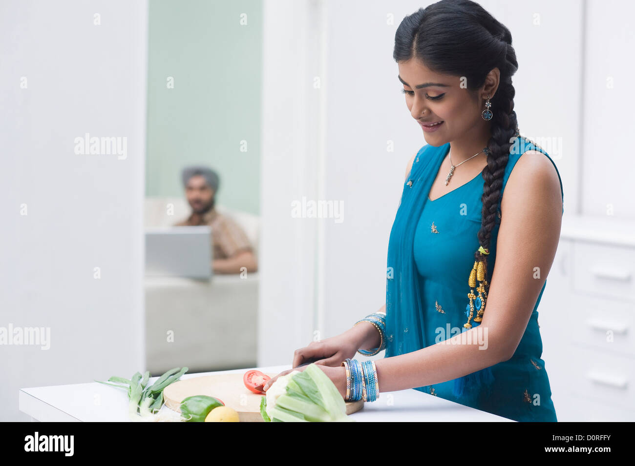 Woman chopping vegetables in the kitchen Stock Photo - Alamy