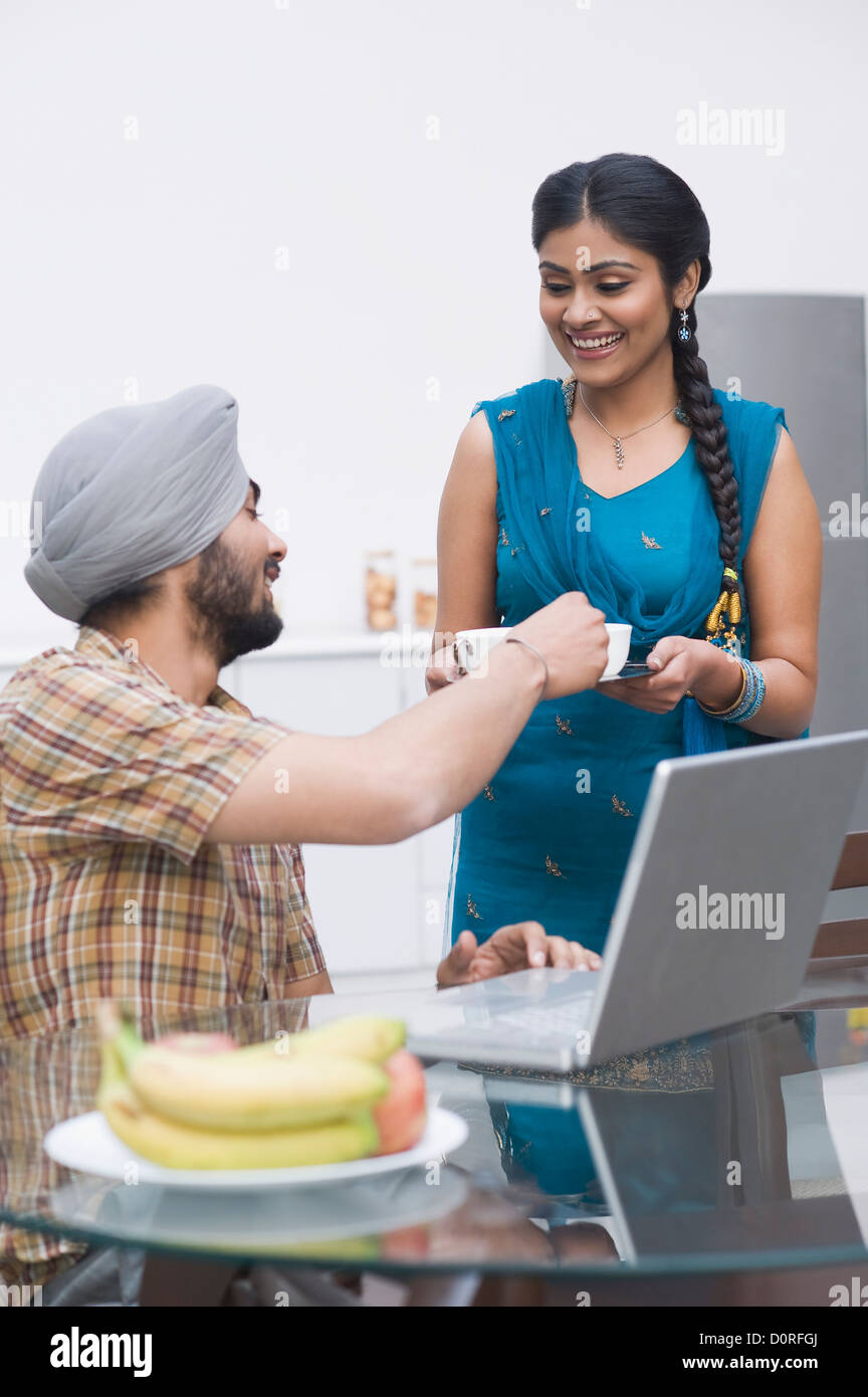 Man bringing tea wife using hi-res stock photography and images - Alamy
