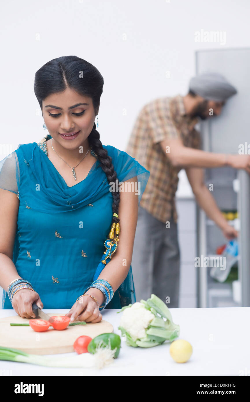 Woman chopping vegetables in the kitchen Stock Photo - Alamy