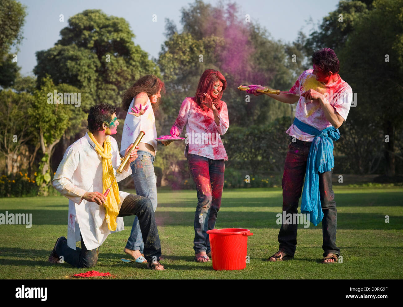 Friends celebrating Holi Stock Photo - Alamy